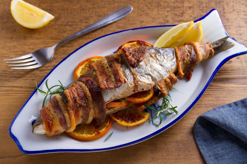 Grilled Bacon-Wrapped Whitefish. Fish Wrapped with Bacon. Stock Image ...