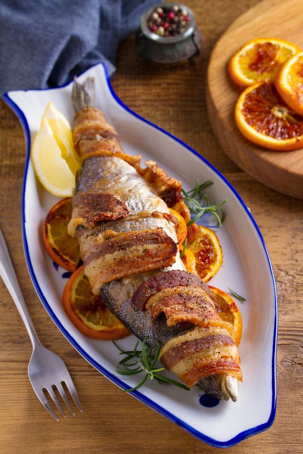 Grilled Bacon-Wrapped Whitefish. Fish Wrapped with Bacon. Stock Photo ...