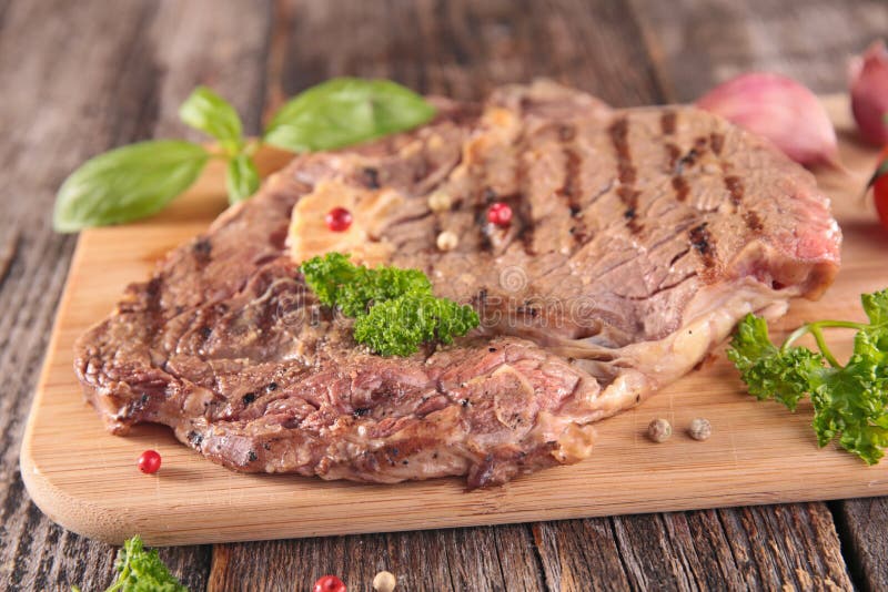 Grilled beef on board stock photo. Image of cuisine, board - 65723122