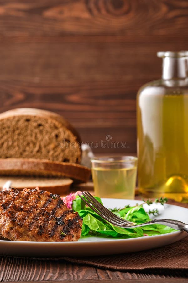 Grilled Beef Cutlet with Fresh Salad, Brown Bread and Moonshine on ...