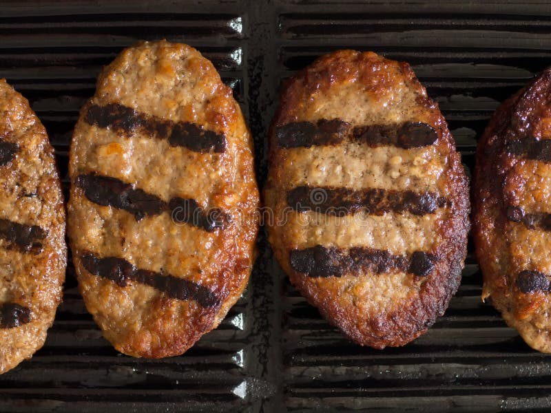 Grilled beef patties stock image. Image of patty, cooked - 18750955