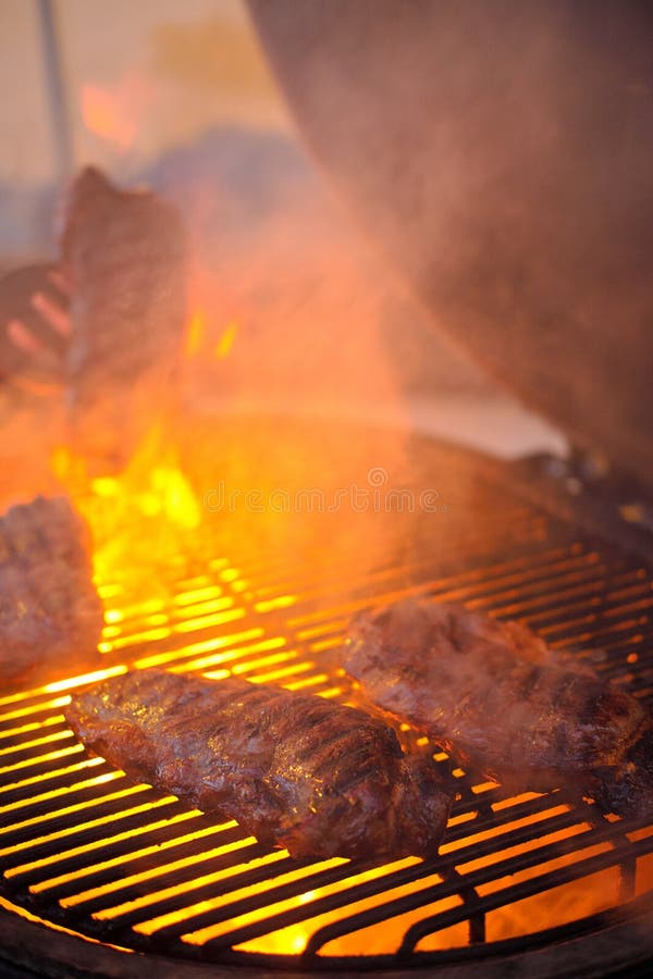Delicious Grilled Beef Steak with Fire on Background Stock Photo ...