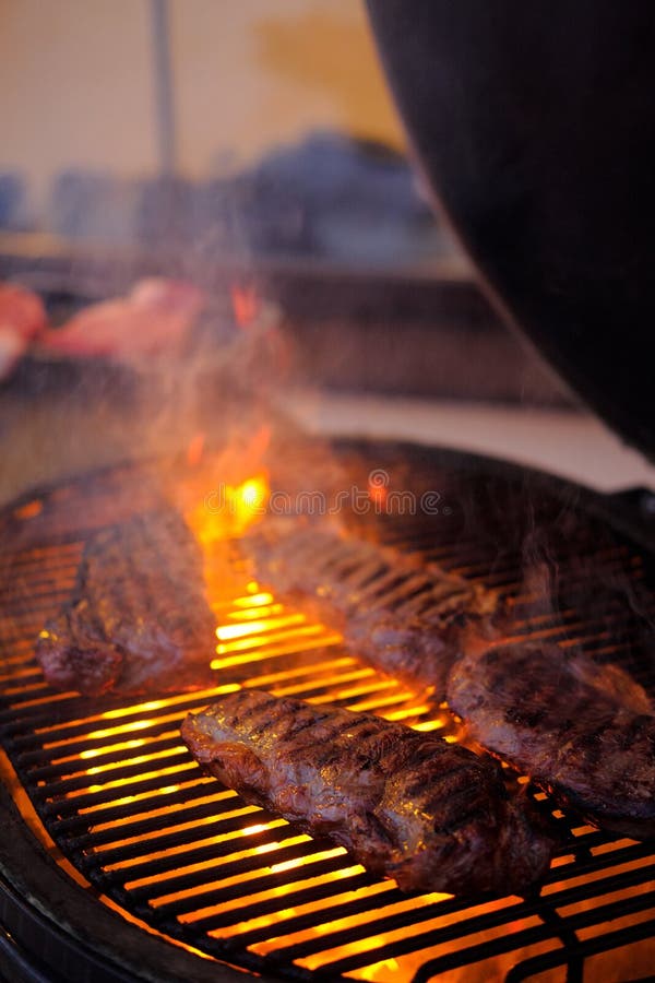 Delicious Grilled Beef Steak with Fire on Background Stock Photo ...
