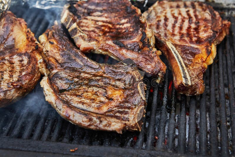 Grilled Beef Steaks with Grill Smoke. BBQ Party Stock Photo - Image of ...