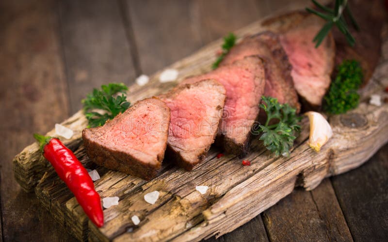 Grilled beef steaks stock photo. Image of herbs, sliced - 84366078