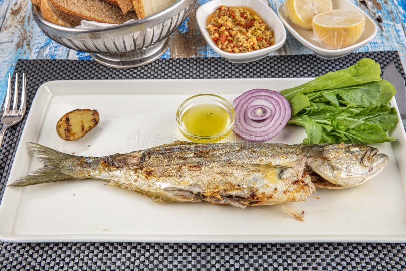 Grilled Bluefish Fish Platter. Bluefish and Appetizers in White Plate ...