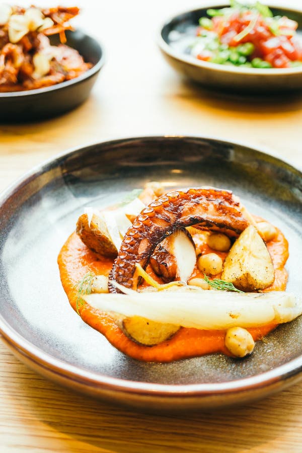 Grilled charred octopus stock photo. Image of dinner - 94554722