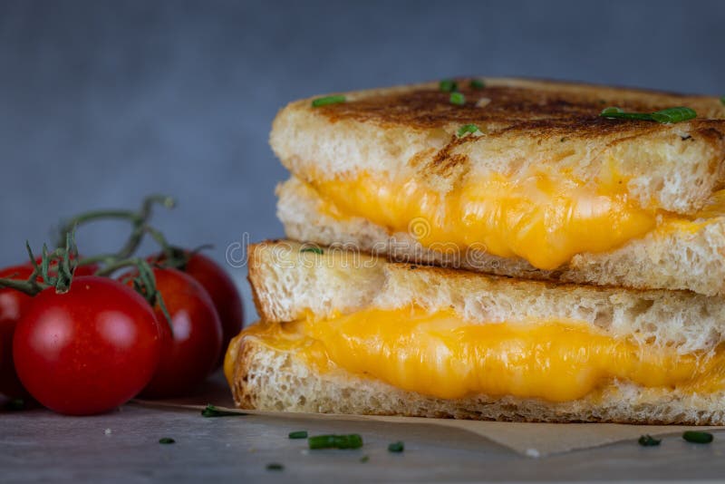 Grilled Cheese with Melting Cheese Dripping from the Inside Stock Image ...