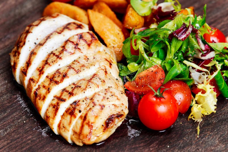 Grilled Chicken Breast. with Potato and Vegetables Stock Image - Image ...