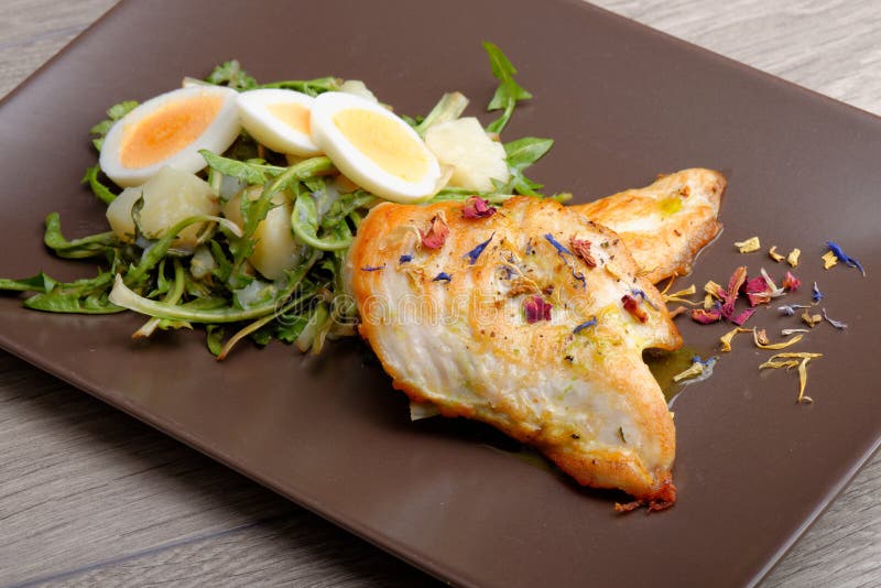Grilled Chicken Fillet and Dandelions Stock Photo - Image of chips ...