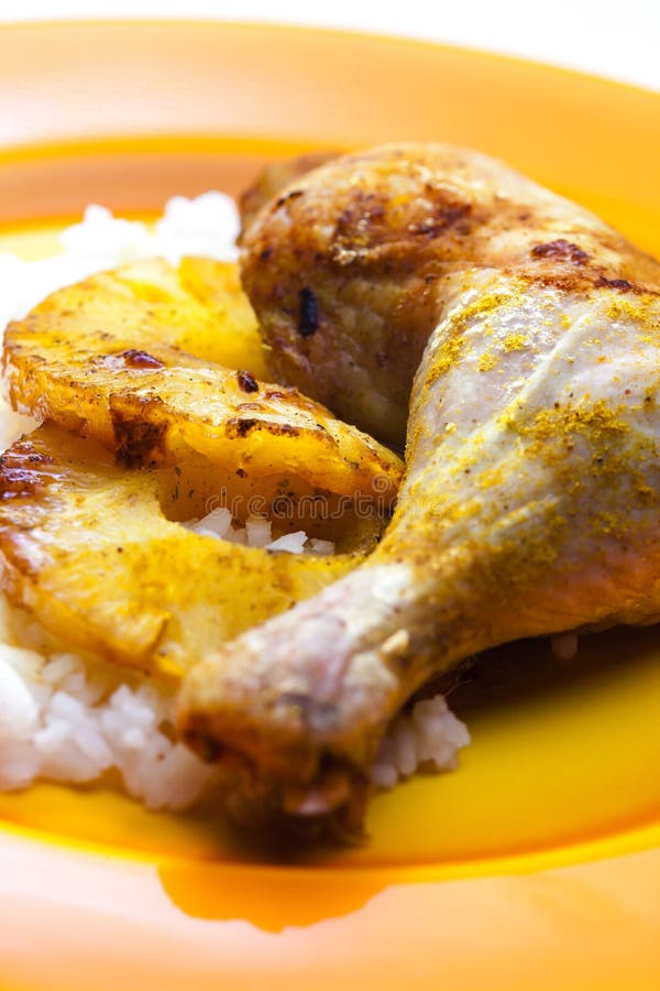 Grilled Chicken Leg Served with Fried Pineapple Slices and Rice Stock ...