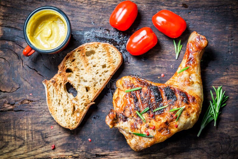 Grilled Chicken Leg with Toast and Cherry Tomato Stock Photo - Image of ...