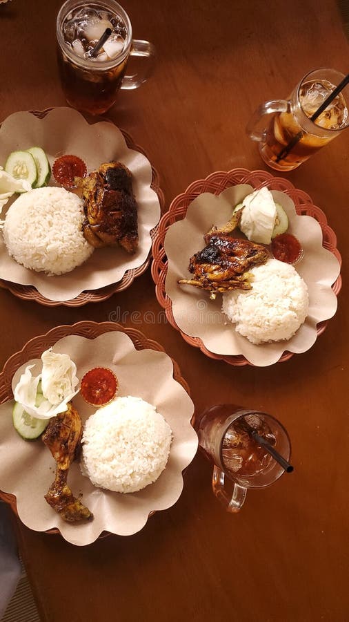 3 Grilled Chicken at Restaurant with Ice Tea Stock Photo - Image of ...