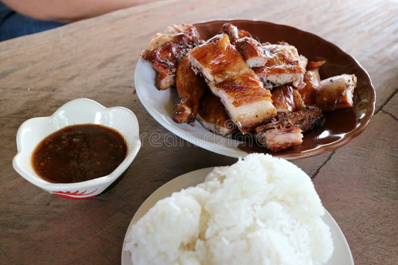 Grilled Chicken Rice and Spicy Sauce on the Table Stock Image - Image ...