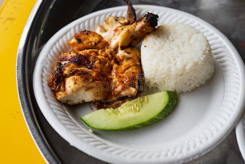 Grilled Chicken Served with Plain White Rice and Cucumber on a ...