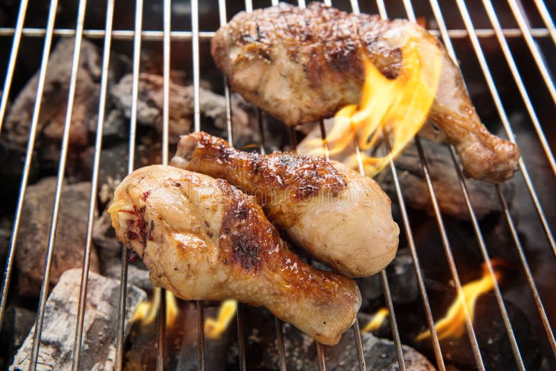Grilled Chicken Thigh Over Flames on a Barbecue Stock Image - Image of ...