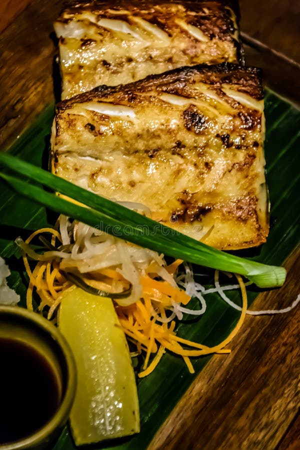Grilled Cod Fish with a Wedge of Lemon and Soy Sauce on the Side Stock ...