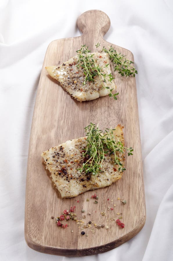 Grilled Cod on a Wooden Board Stock Photo - Image of grilled, board ...
