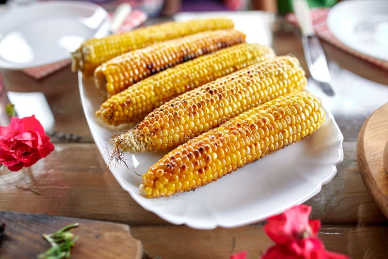Grilled Corn Cobs on Plate on the Dinner Table, Appetizers Stock Image ...