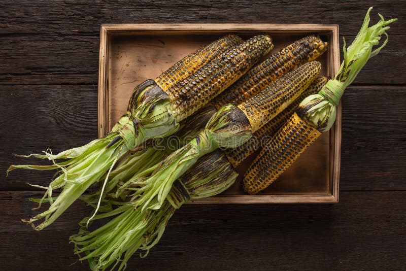 Grilled Corn, Top View, Heap of Grilled Corn on a Wooden Table Stock ...