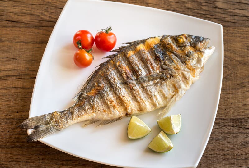 Grilled Dorada with Lemon and Cherry Tomatoes Stock Photo - Image of ...
