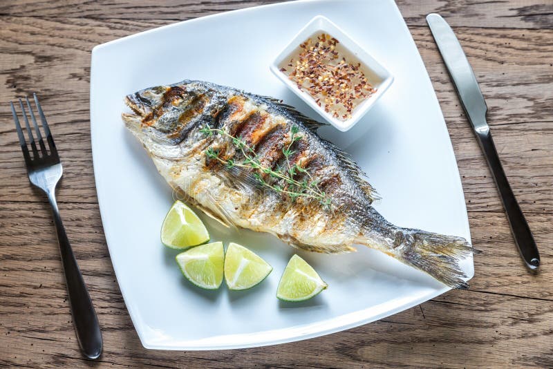 Grilled Dorade Royale Fish on the Plate Stock Photo - Image of plate ...