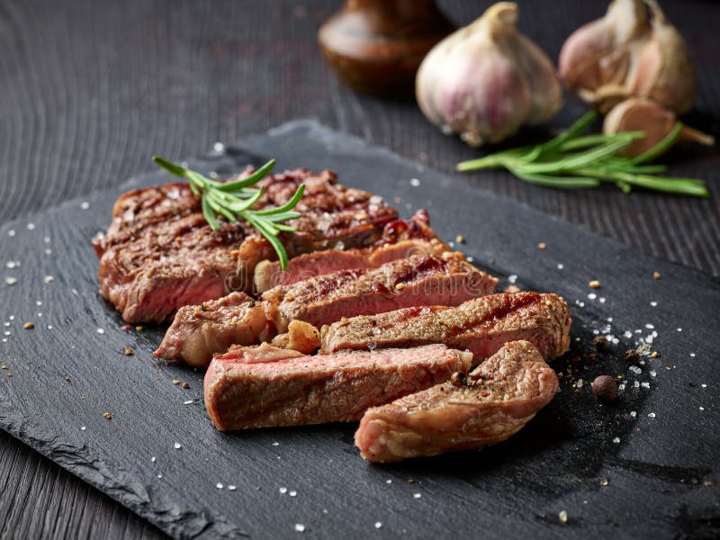 Grilled Entrecote on Black Stone Board Stock Photo - Image of medium ...