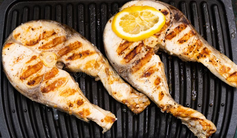 Grilled Fish in Grill Pan with Lemon Stock Photo - Image of steak ...