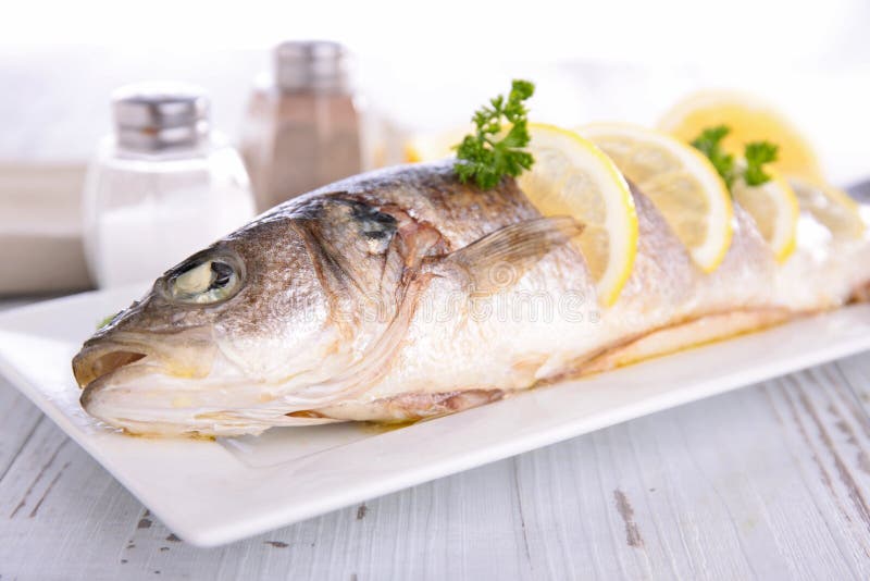 Grilled fish and lemon stock photo. Image of lemon, healthy - 161961596