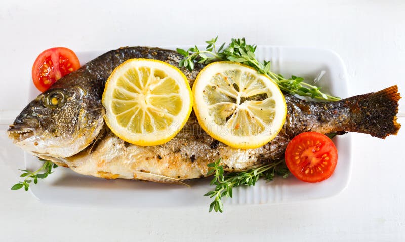 Grilled fish with lemon stock image. Image of food, thyme - 31828595