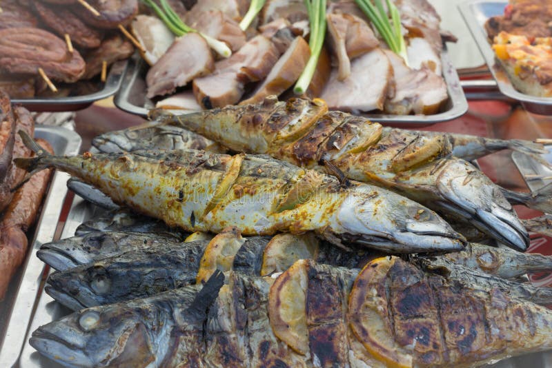 Grilled Fish with Lemon Slices in the Notches Stock Image - Image of ...