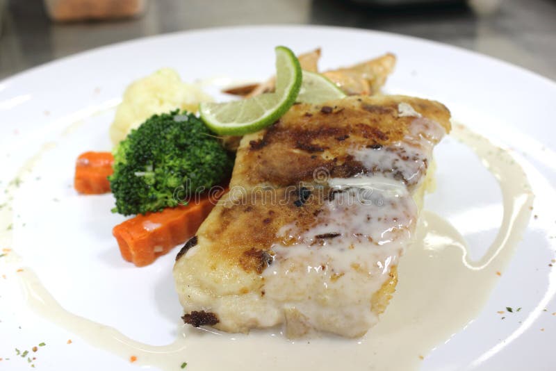 Grilled fish on the plate stock photo. Image of prawn - 42435306