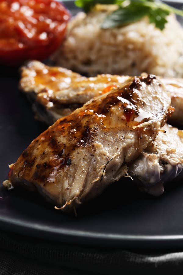 Grilled Fish with Rice Closeup Stock Photo - Image of closeup, napkin ...