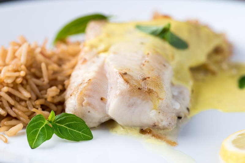 Grilled Fish with Rice and Lemon Sauce Stock Photo - Image of lunch ...