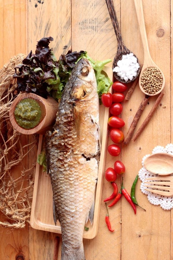 Grilled Fish of Salt with Spicy Sauce Delicious. Stock Photo - Image of ...