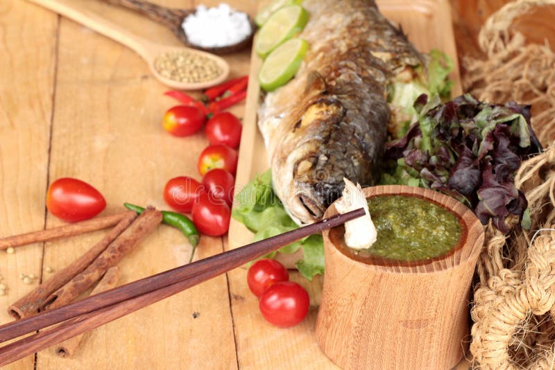 Grilled Fish of Salt with Spicy Sauce Delicious. Stock Image - Image of ...