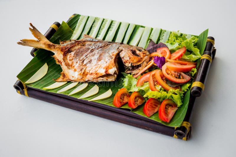 Grilled Fish with Vegetables, Palm Leaf. Restaurant. Stock Image ...