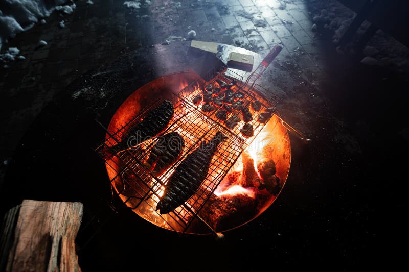 Grilled Fresh Seafood with Fish at Night Barbecue Stock Photo - Image ...