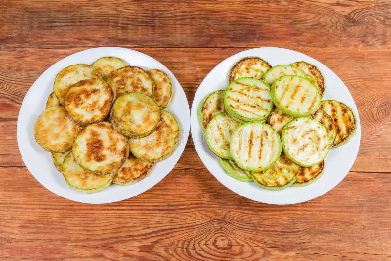 Grilled and Fried Chopped by Circles Vegetable Marrows on Dishes Stock ...