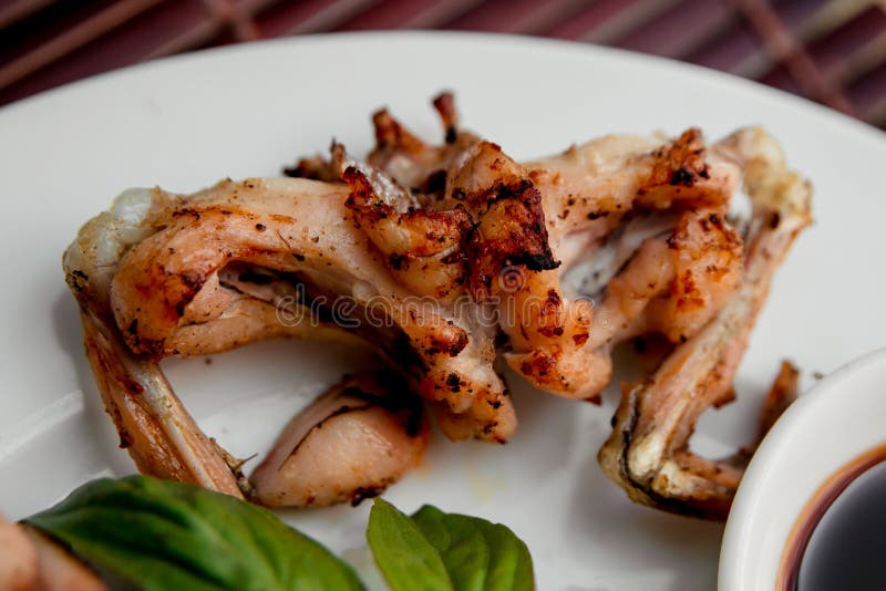 Grilled Frog Legs on the White Plate Stock Photo - Image of recipe ...