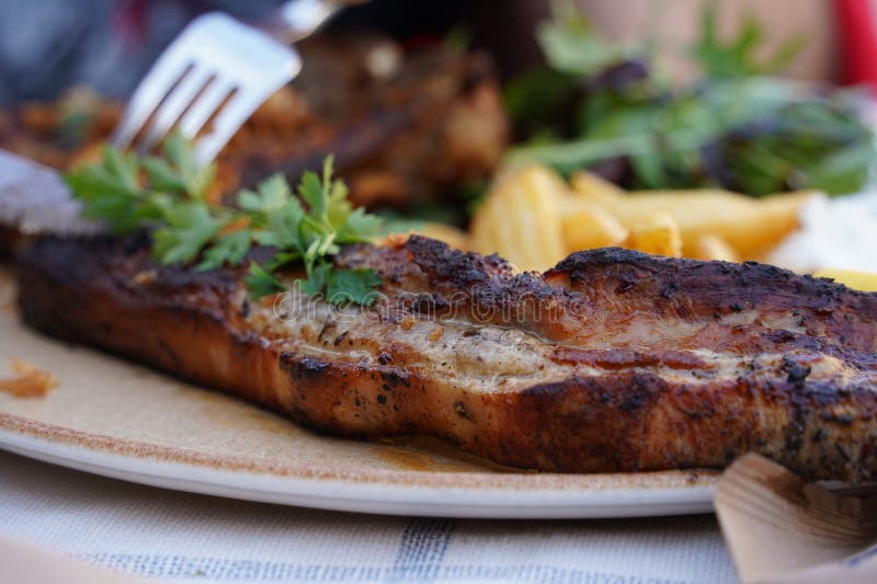 Grilled Giant Pork Chop with Chips and Salad Stock Photo - Image of ...