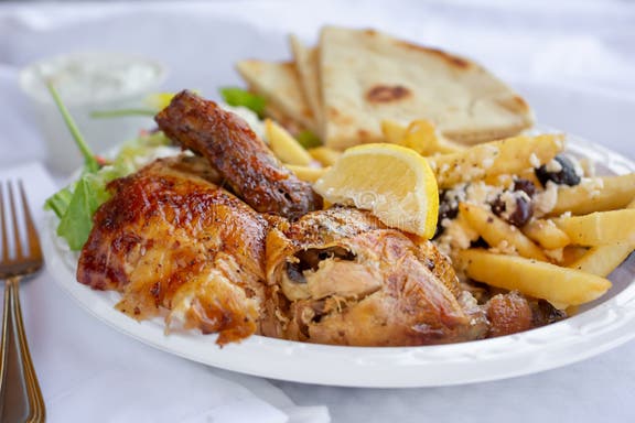 Grilled half chicken plate stock image. Image of mediterranean - 281966365