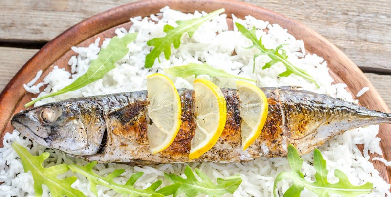Grilled Mackerel with Basmati Rice and Fresh Arugula Stock Photo ...
