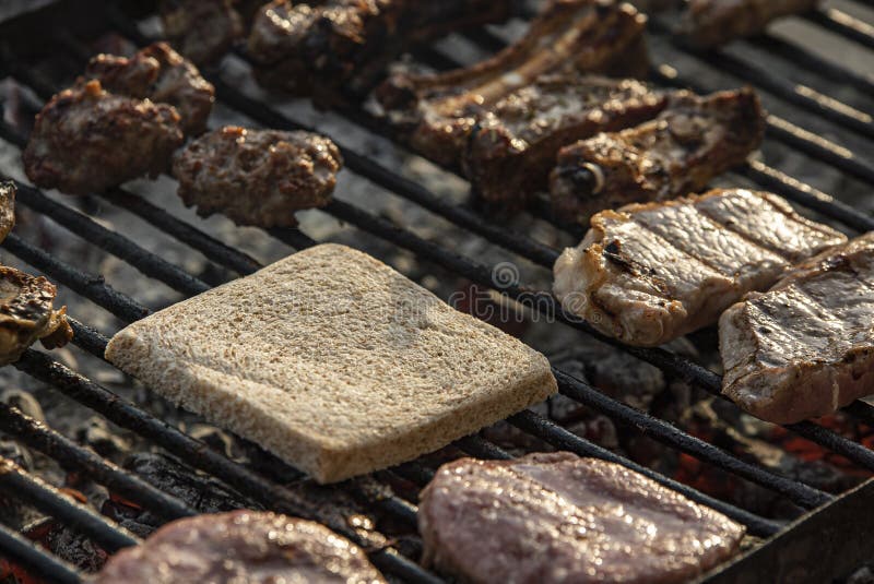 Grilled meat and bread 3 stock image. Image of gourmet - 222747063
