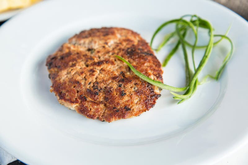 Grilled meat cutlet served stock image. Image of baked - 39095719