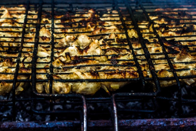 Grilled meat on the grill stock photo. Image of barbecuing - 142182966