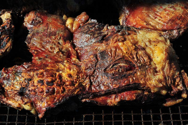 Grilled Meat Meat on Spit with Fire. Argentinian Ancho Steak Beef Meat ...