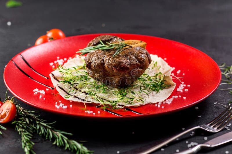 Grilled Meat Steak on Pita Leaf in a Red Plate Stock Photo - Image of ...