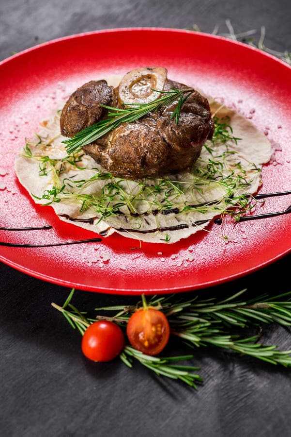 Grilled Meat Steak on Pita Leaf in a Red Plate Stock Image - Image of ...