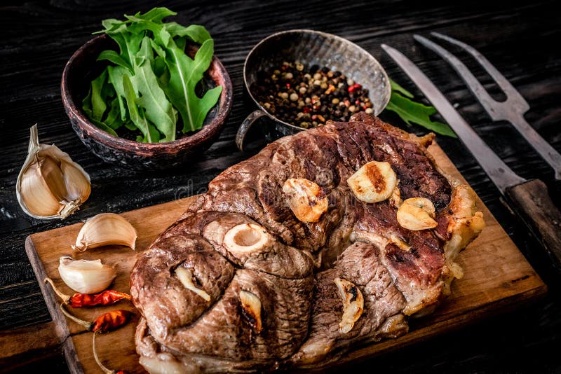 Grilled meat on a table stock photo. Image of fork, cook - 130992218